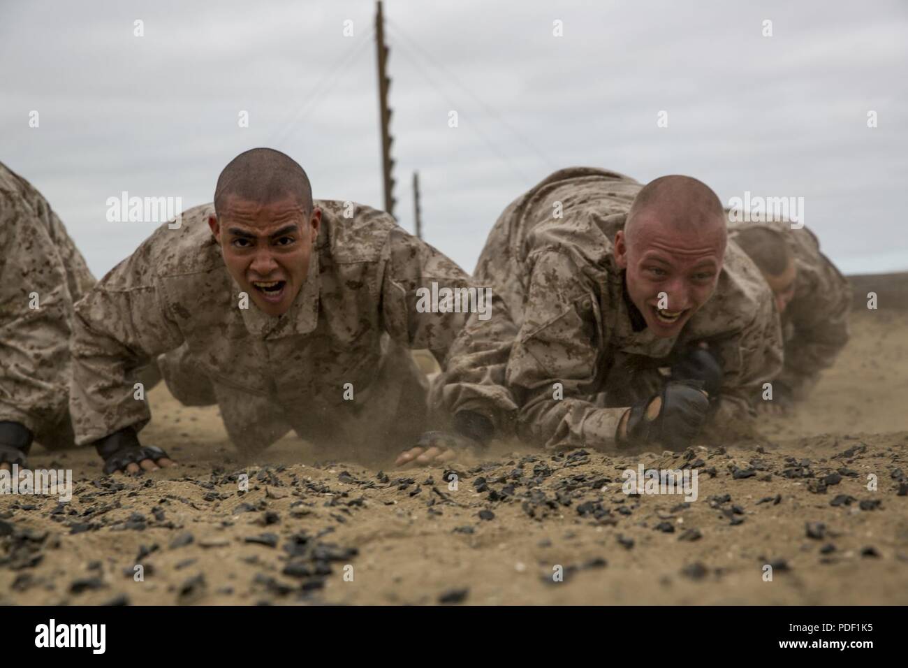 Recruits with Kilo Company, 3rd Recruit Training Battalion, crawl ...