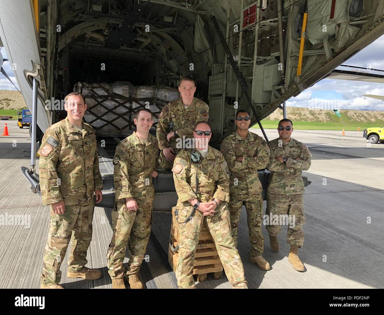 U.S. Air Force Airmen assigned to the 317th Airlift Wing take a group ...