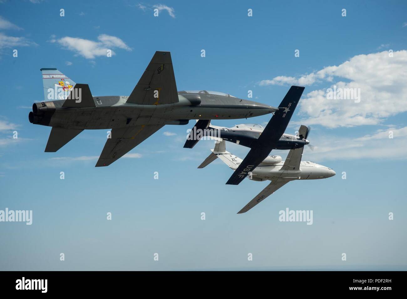 A T-1 Jayhawk, T-6 Texan II, and T-38 Talon fly in a dissimilar ...