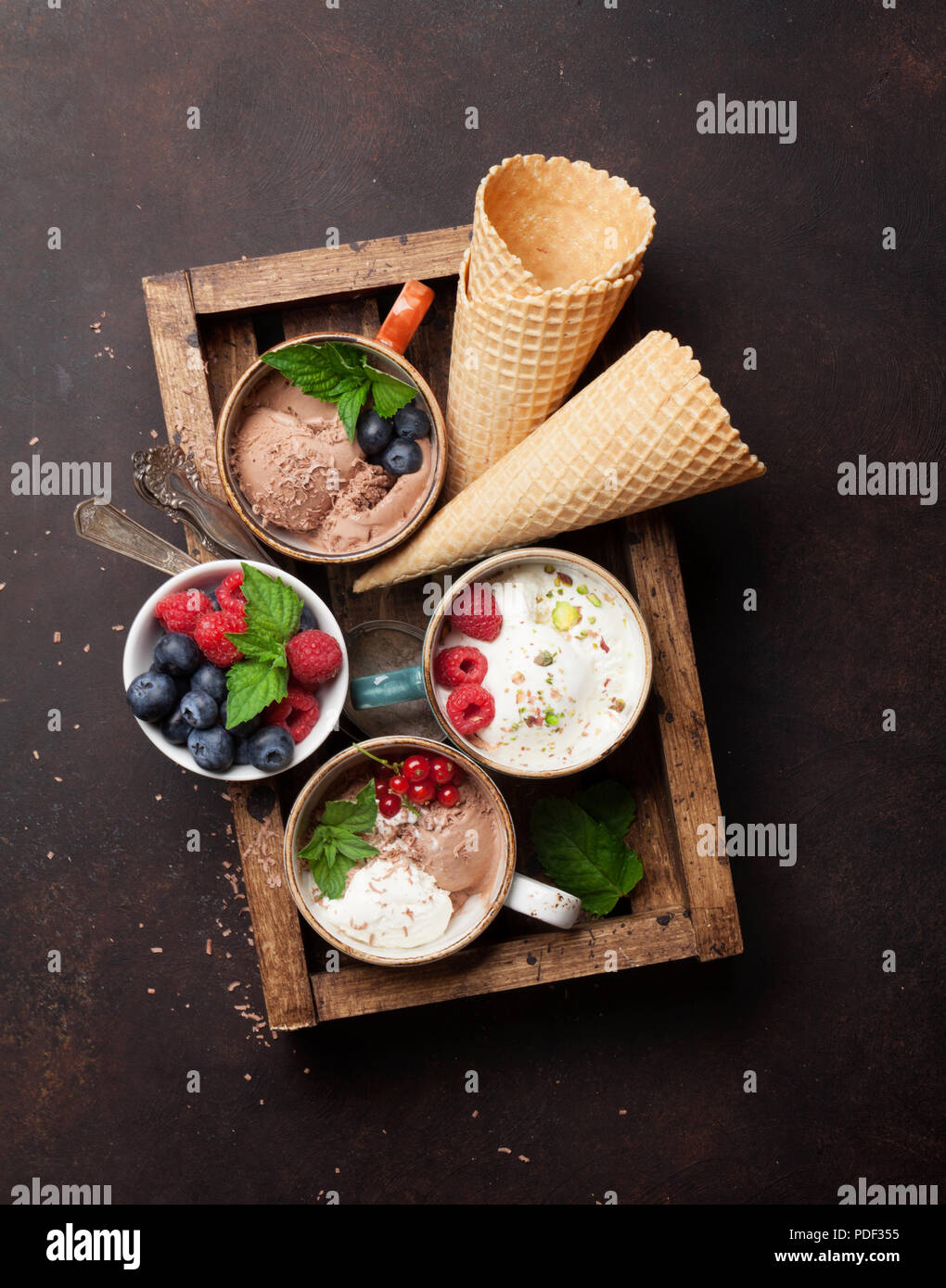 Ice cream with berries in wooden box. Top view Stock Photo - Alamy
