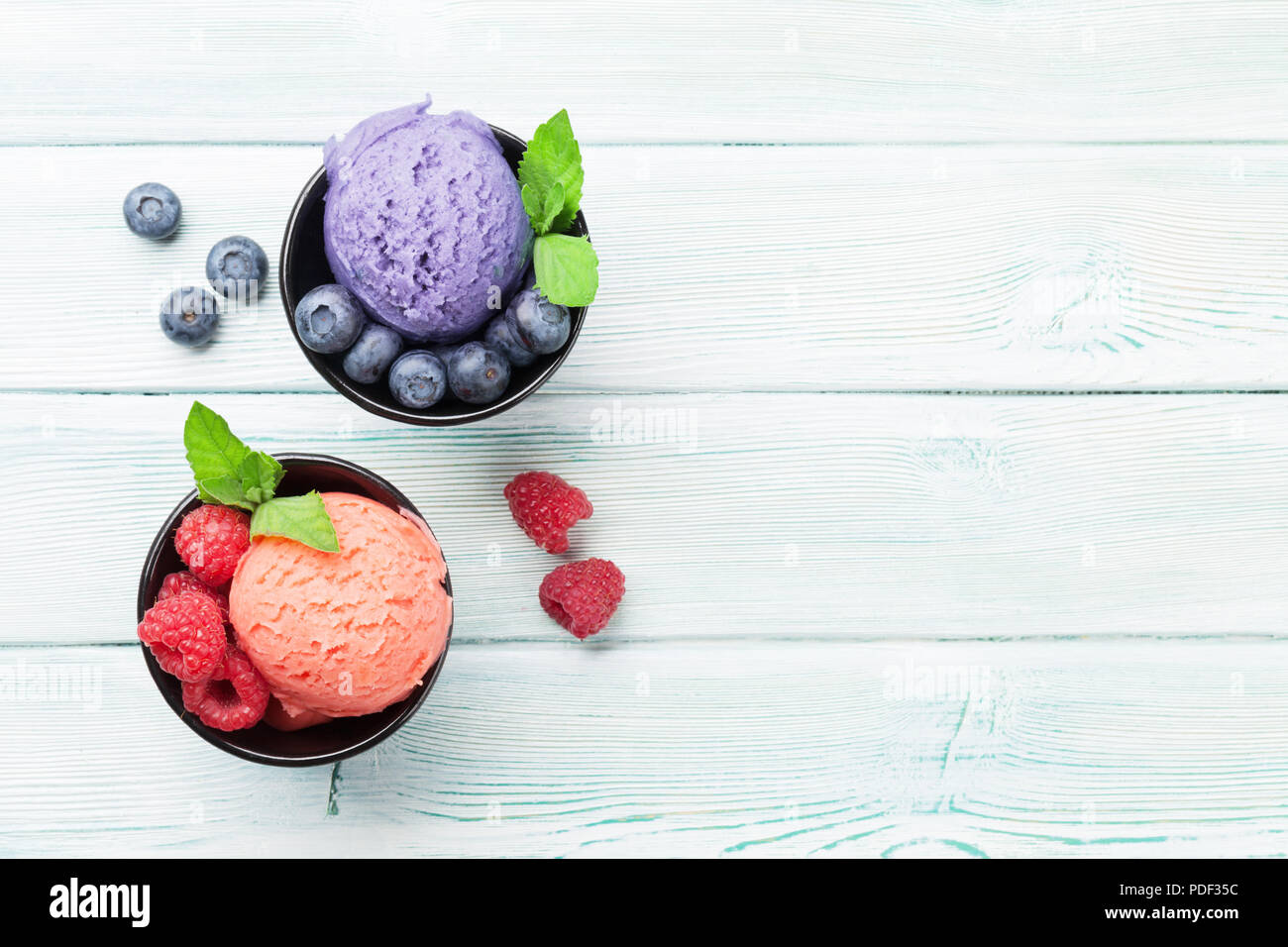 Ice cream with raspberry and blueberry. Top view with space for your ...