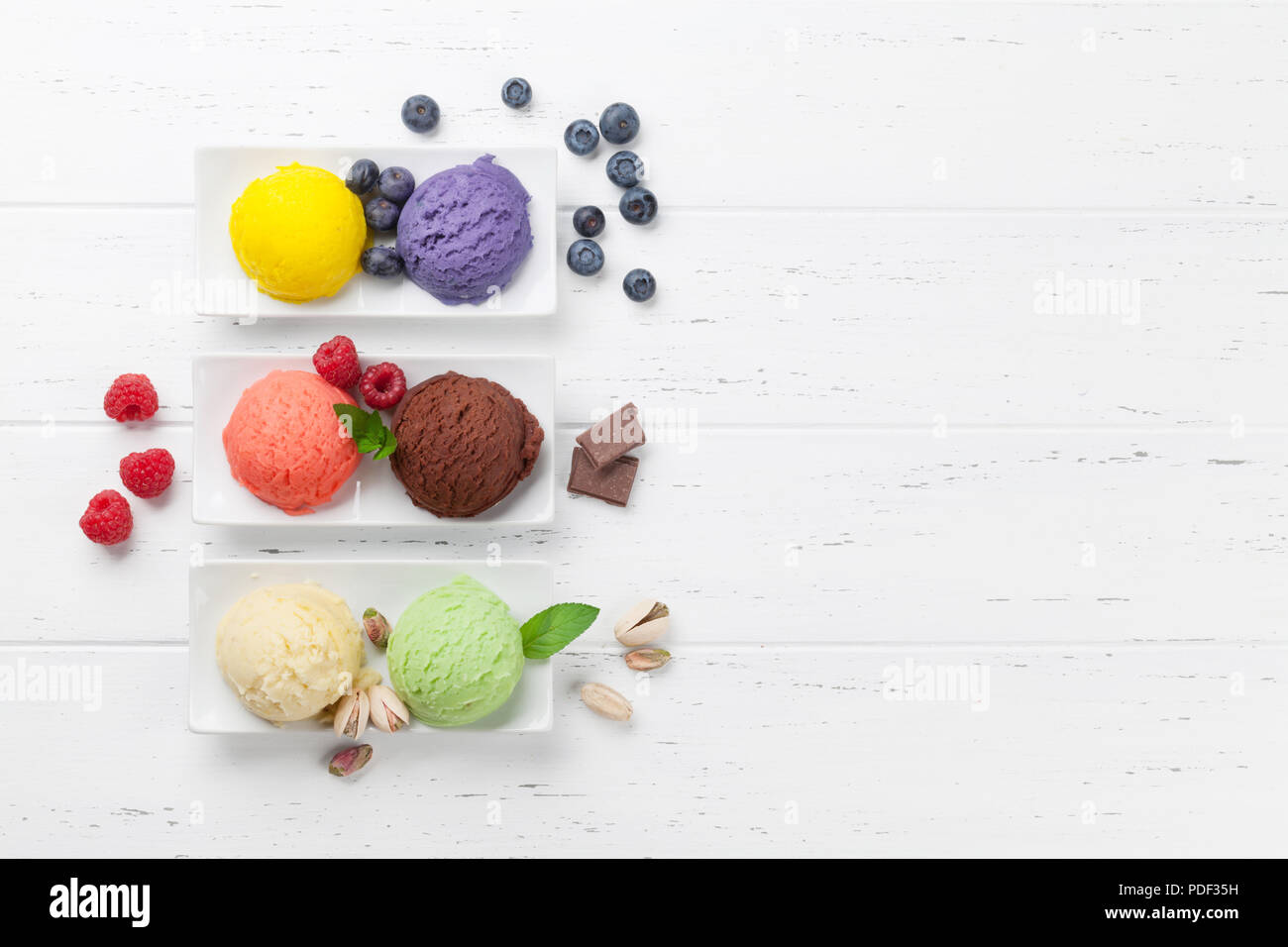 Ice cream with nuts and berries. Top view with space for your text ...