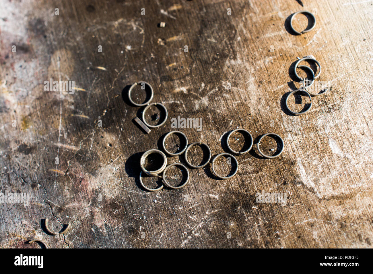 metal pieces of round ring shape on dark background Stock Photo - Alamy