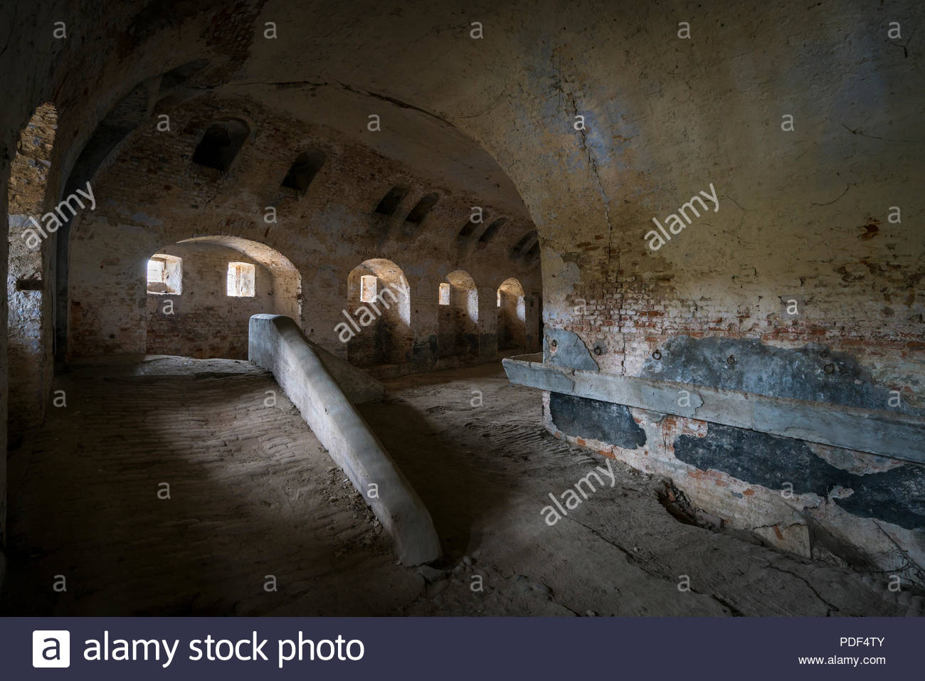 Decaying interior of an abandoned building with peeling paint and ...
