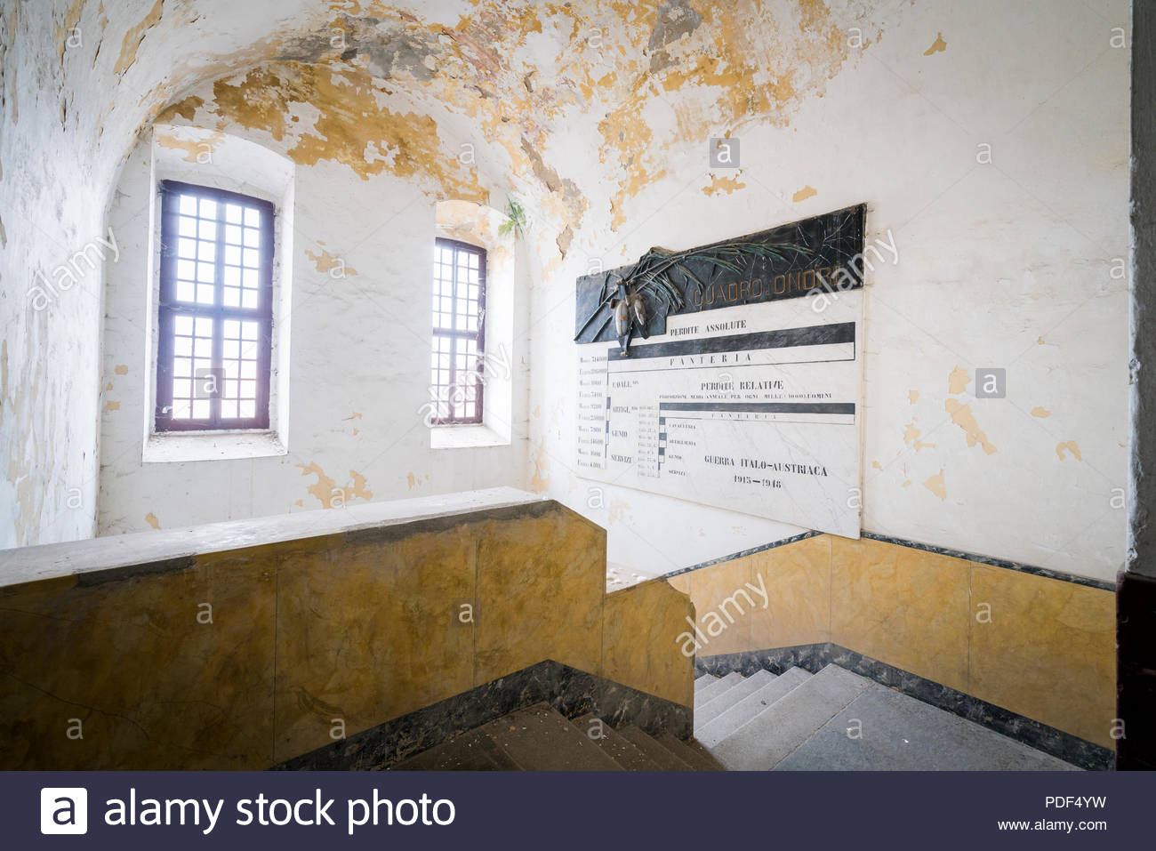 Decaying interior of an abandoned building with peeling paint and ...