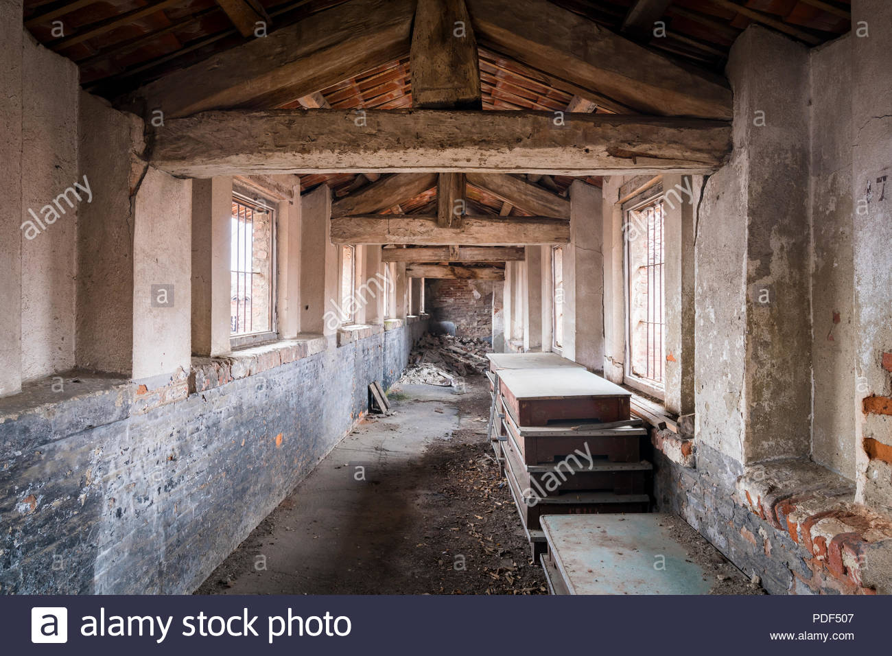 Decaying interior of an abandoned building with peeling paint and ...