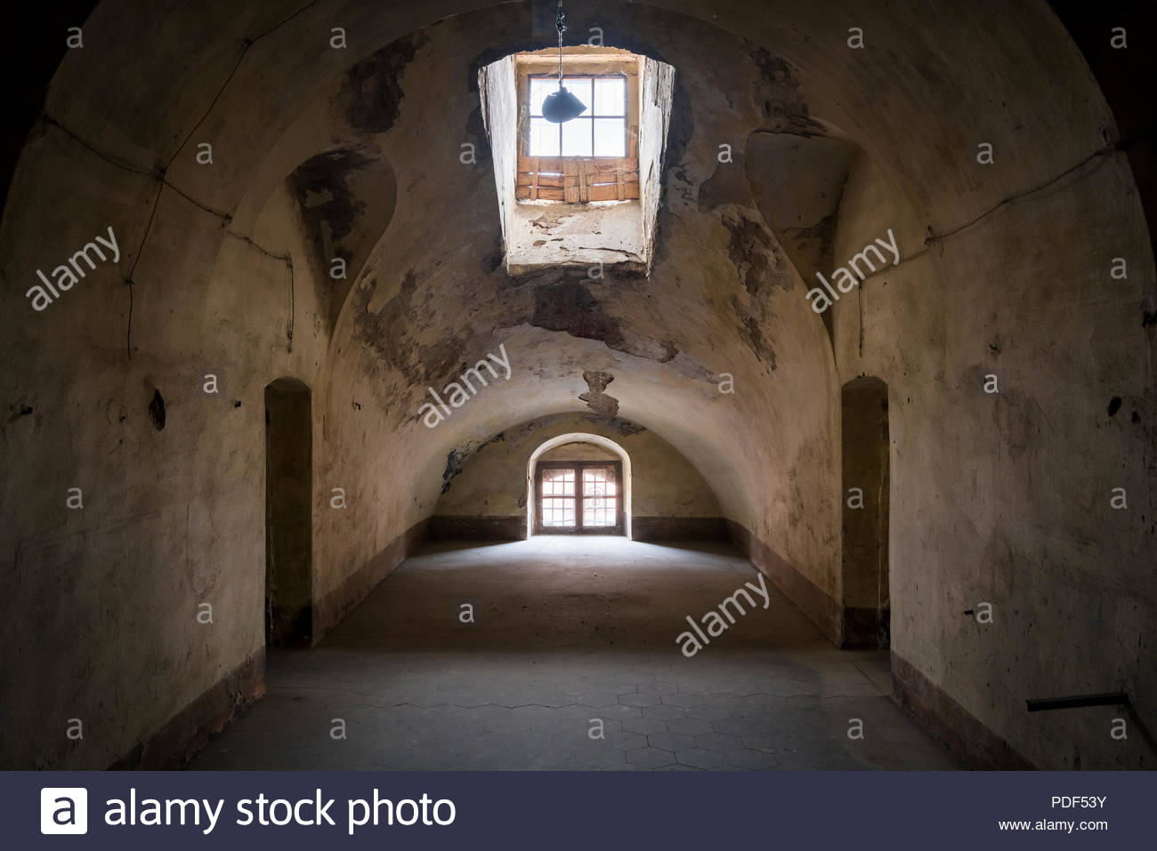 Decaying interior of an abandoned building with peeling paint and ...