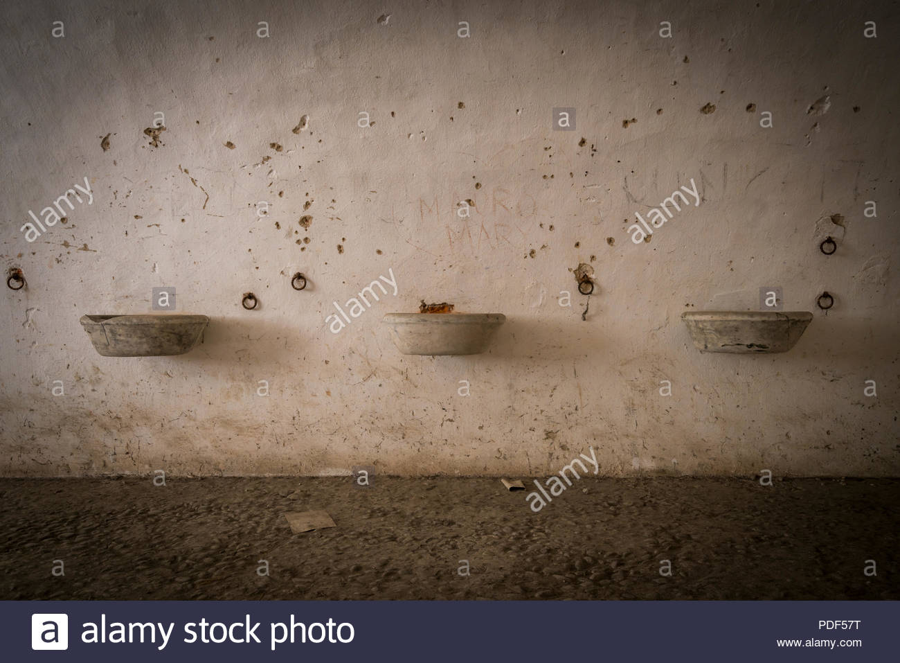 Decaying interior of an abandoned building with peeling paint and ...