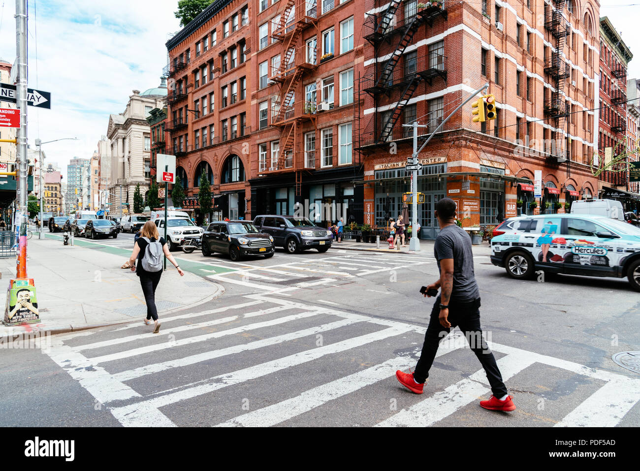 New York City, USA - June 20, 2018: People crossing street in Little ...