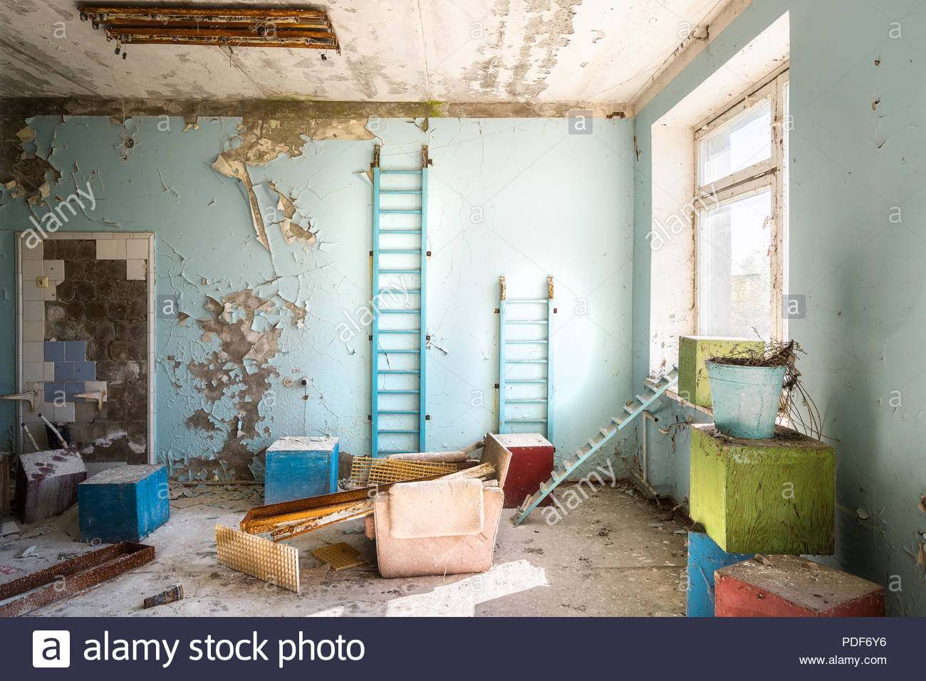 Decaying interior of an abandoned building with peeling paint and ...