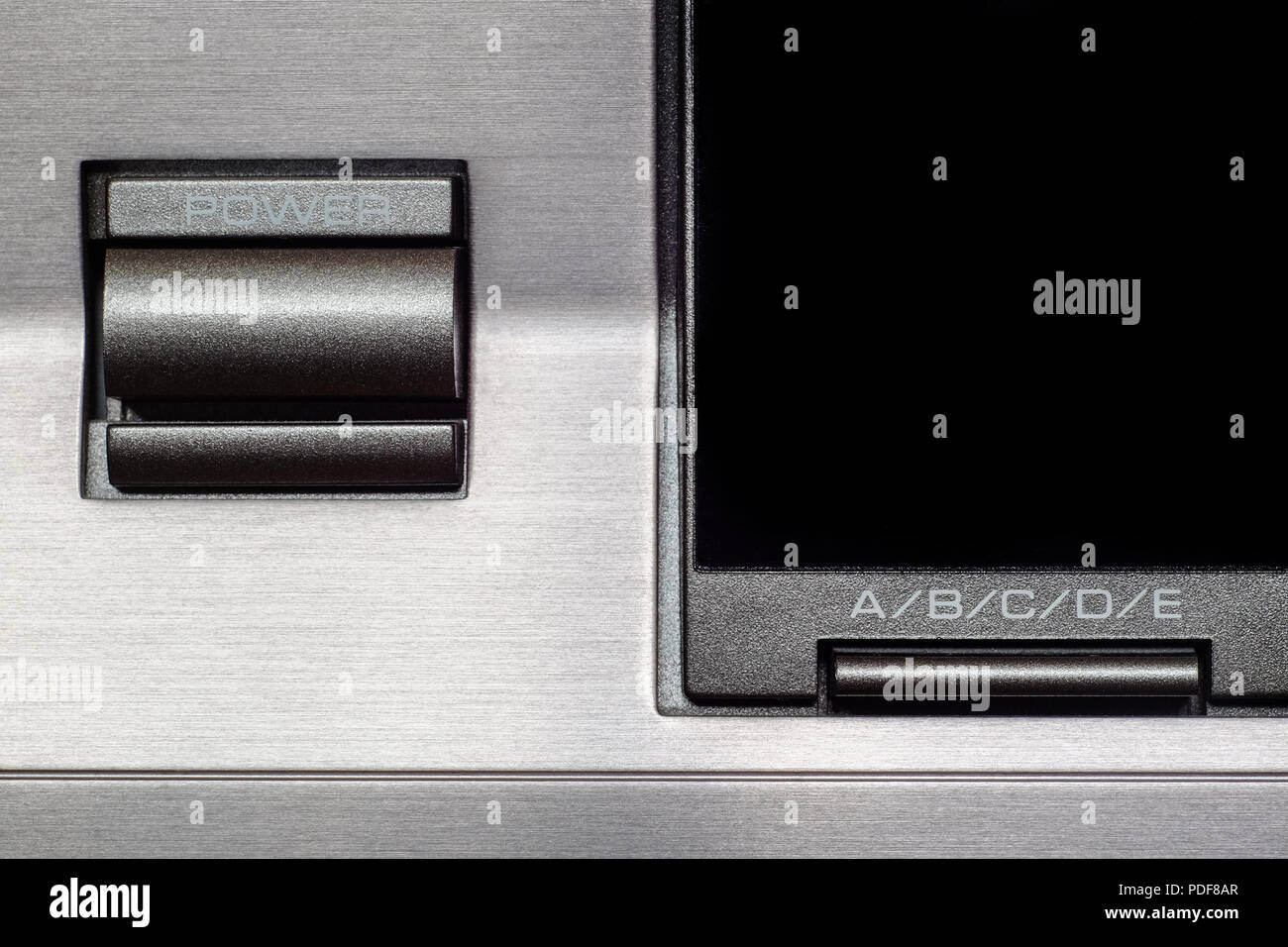 The on-off button. The volume control on the receiver panel is gray ...