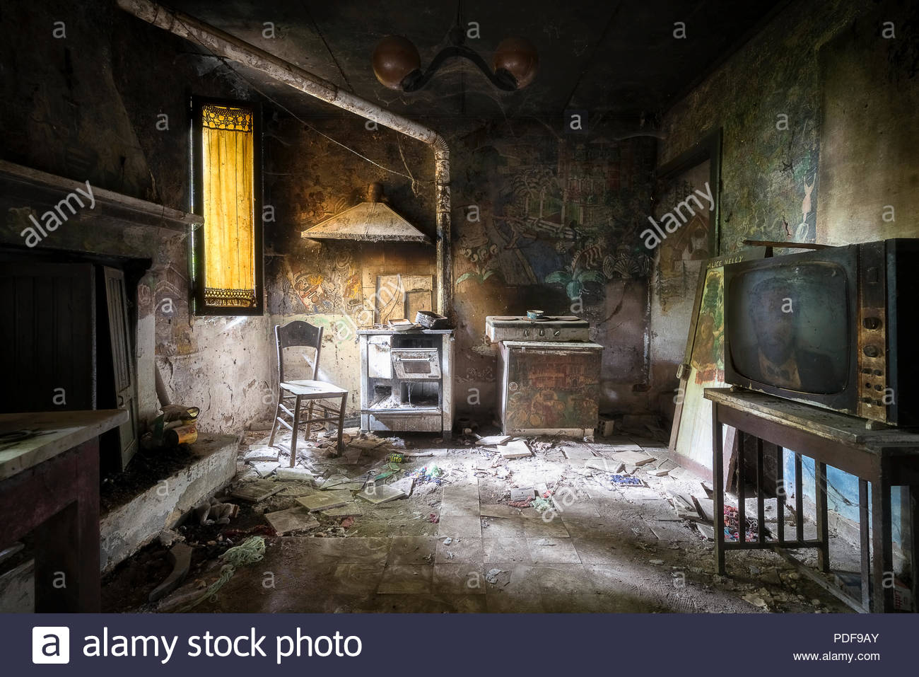 Decaying interior of an abandoned building with peeling paint and ...