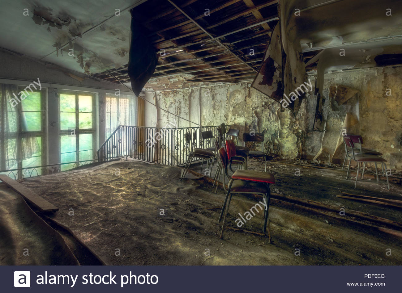 Decaying interior of an abandoned building with peeling paint and ...