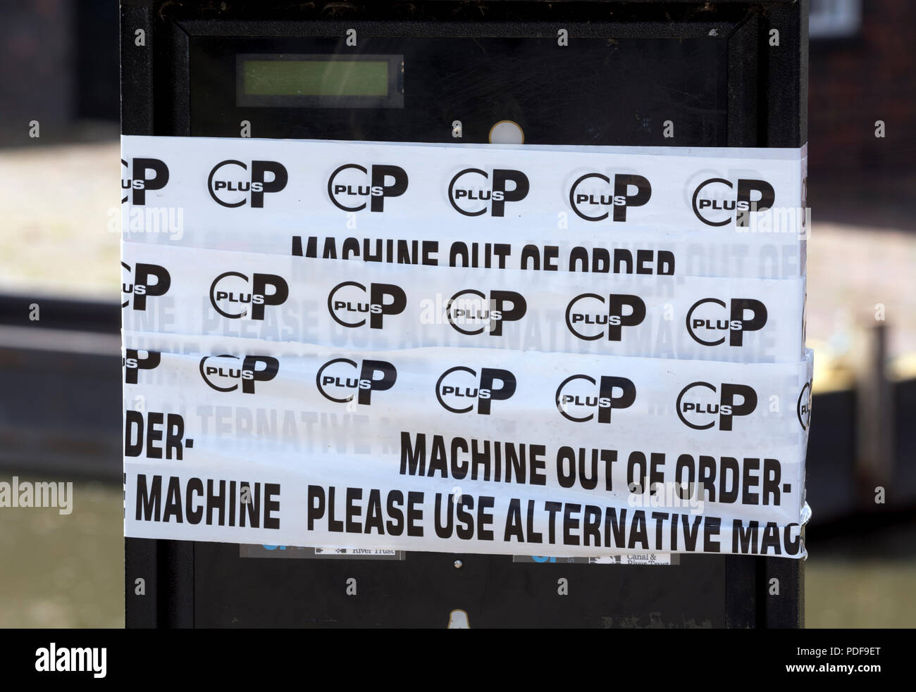 Car park machine out of order, taped over, UK Stock Photo - Alamy