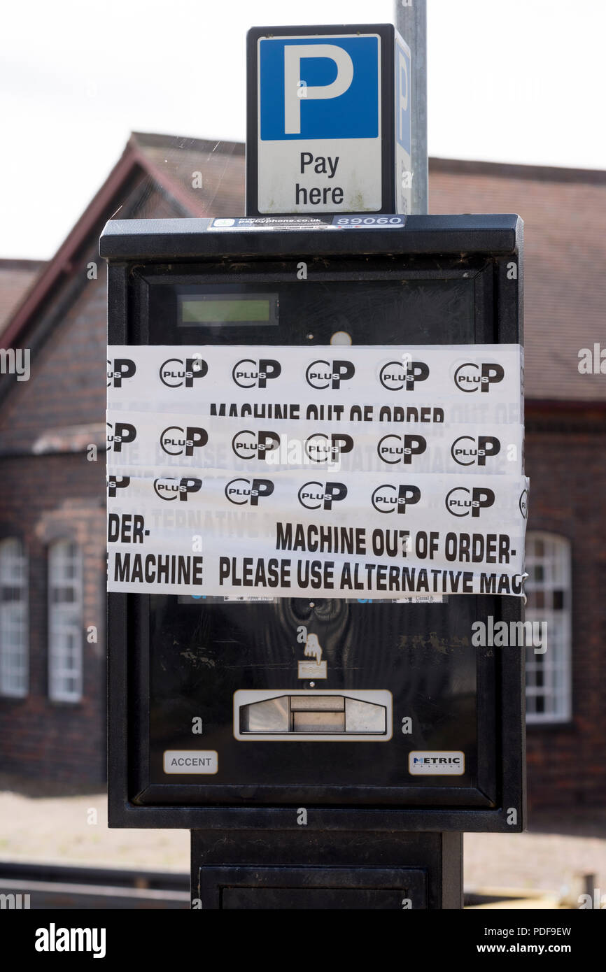 Car park machine out of order, taped over, UK Stock Photo - Alamy