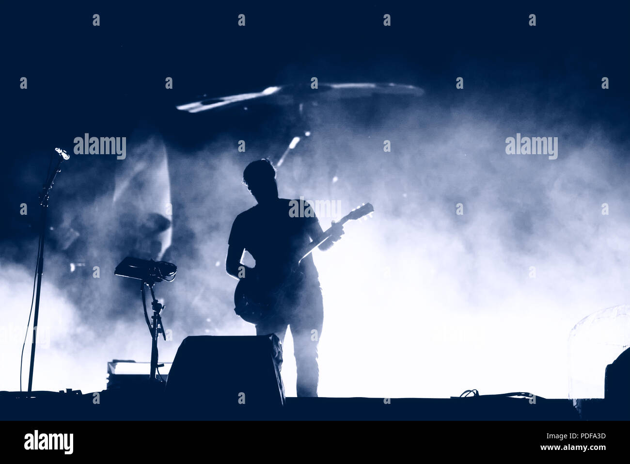 Guitarist silhouette on the stage playing live music Stock Photo - Alamy