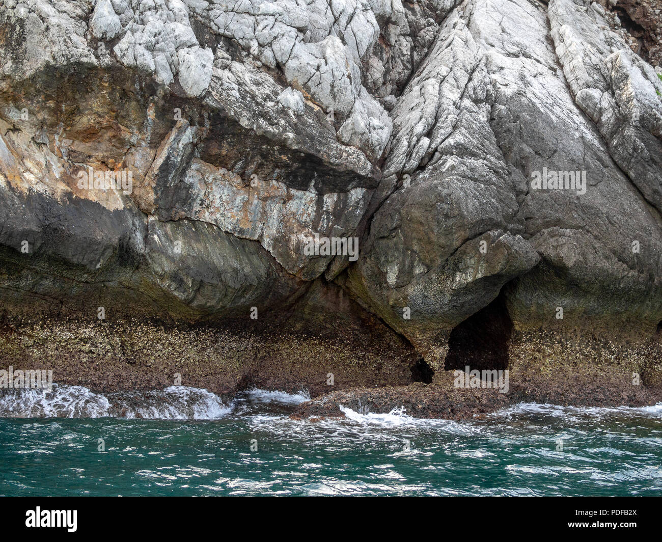 The rock cliff island mountain in the sea. Close-up stone Texture Stock ...