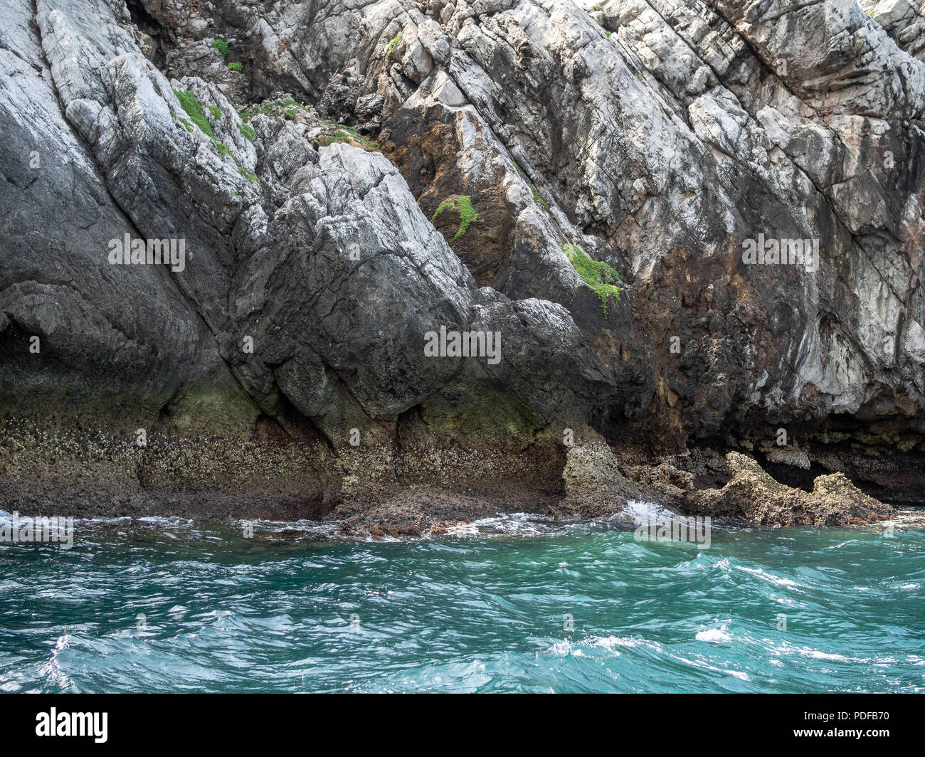 The rock cliff island mountain in the sea. Close-up stone Texture Stock ...