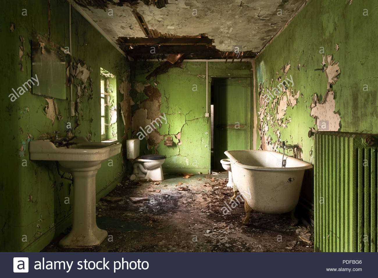 Decaying interior of an abandoned building with peeling paint and ...