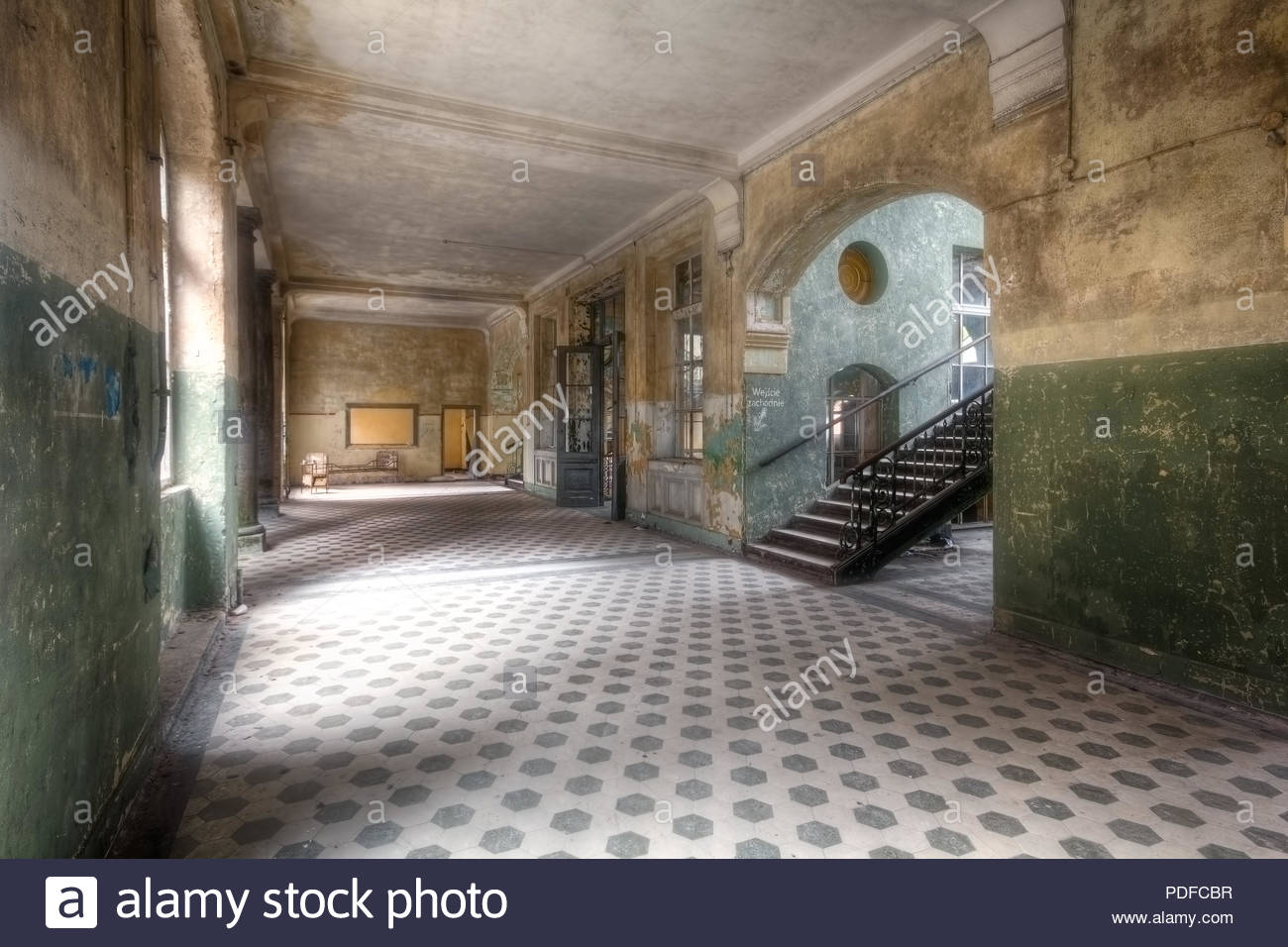 Decaying interior of an abandoned building with peeling paint and ...