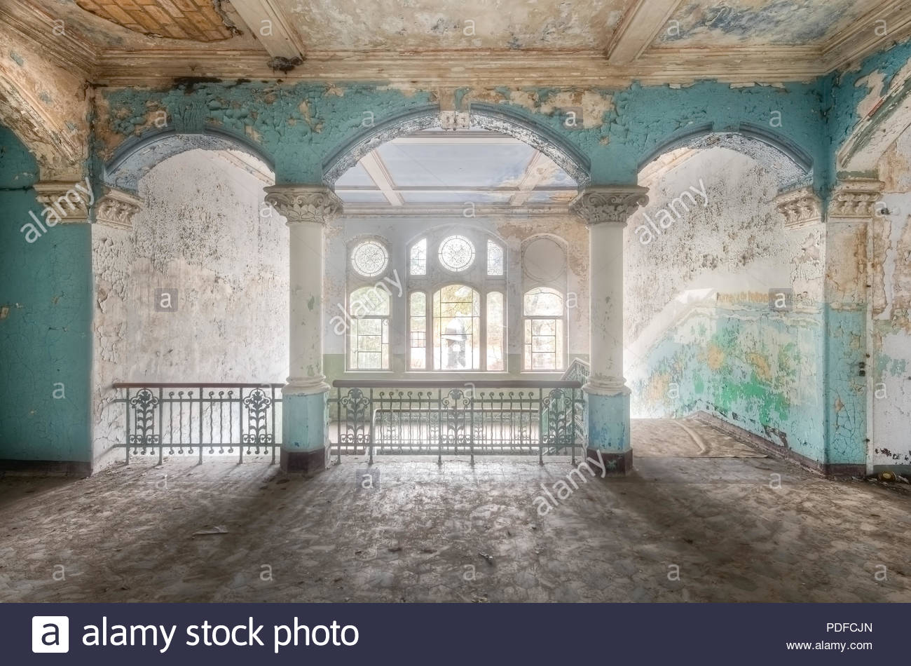 Decaying interior of an abandoned building with peeling paint and ...