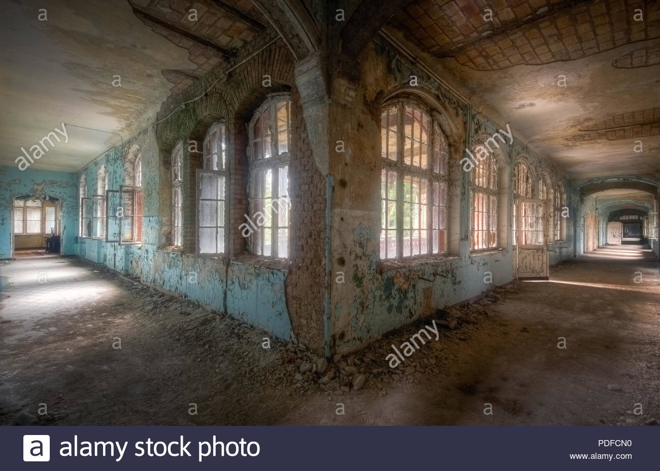 Decaying interior of an abandoned building with peeling paint and ...