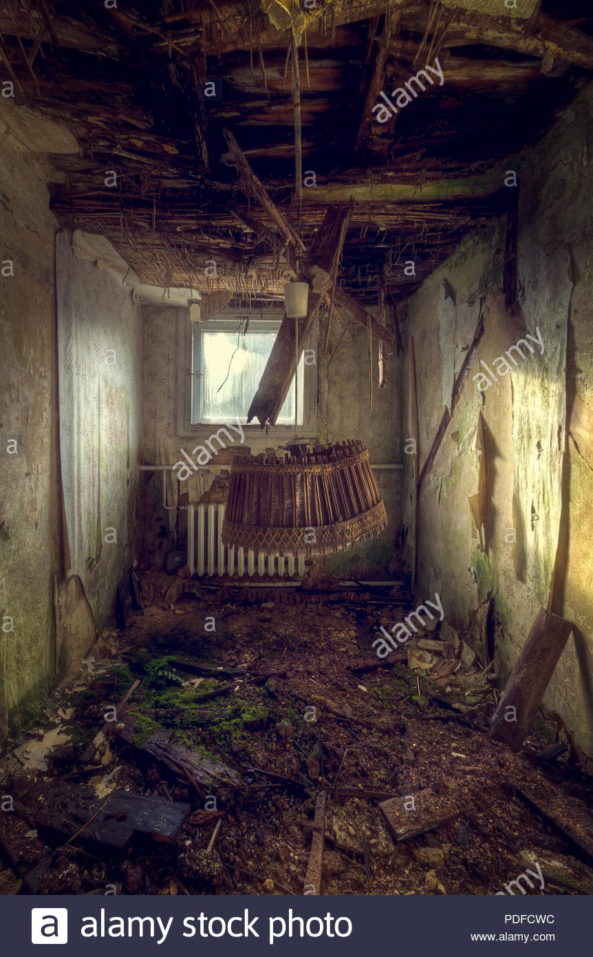 Decaying interior of an abandoned building with peeling paint and ...