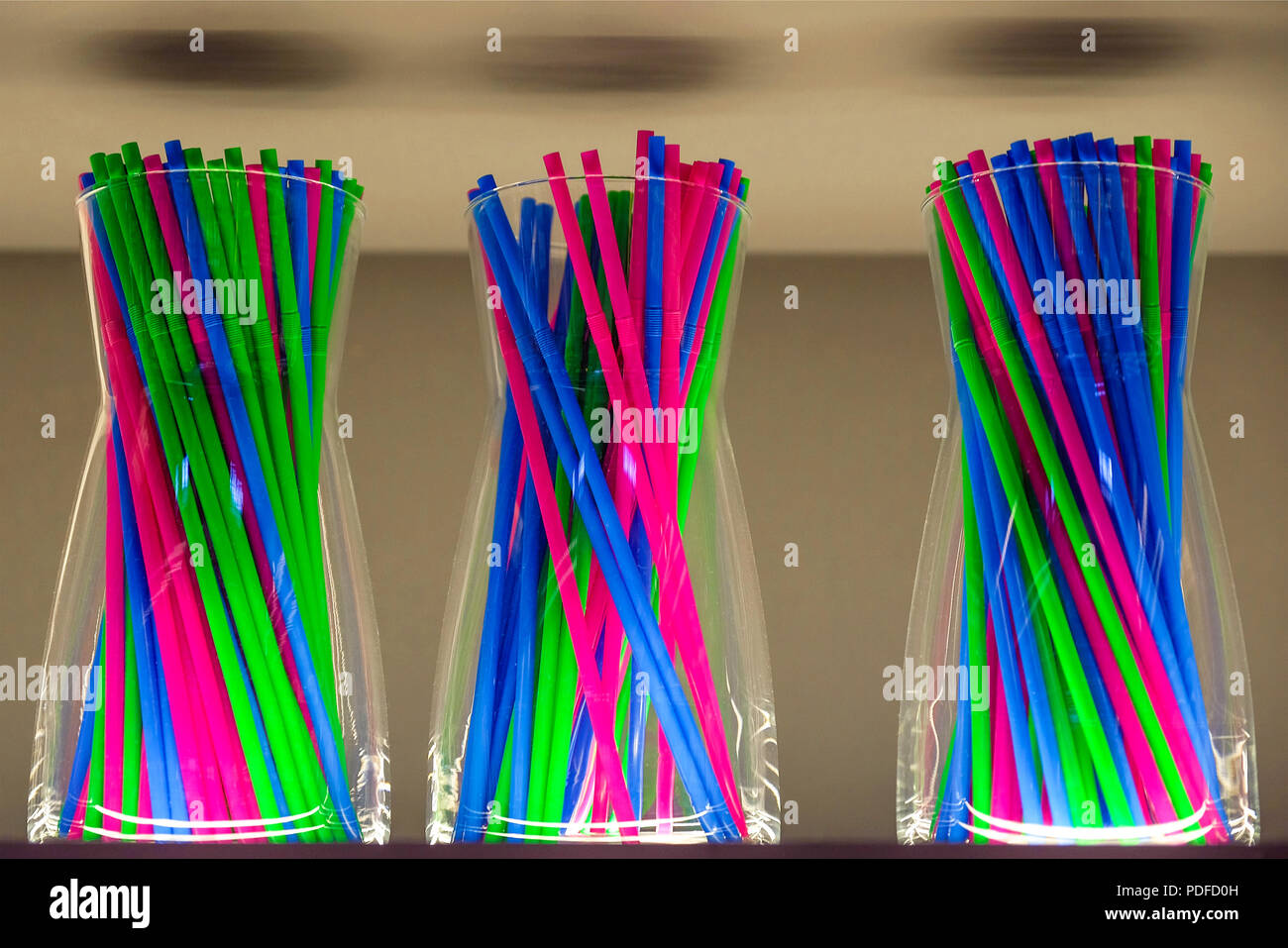 Straw straw for cocktails. Mixed color of straw sticks. Blue green red ...