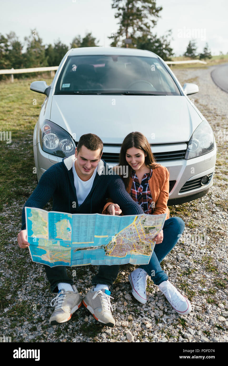 Person in car looking at map hi-res stock photography and images - Alamy