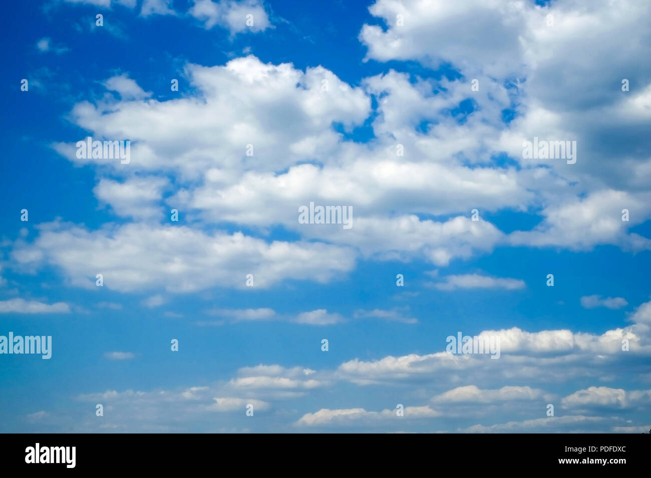 Blue Sky with clouds, a warm summer day Stock Photo - Alamy