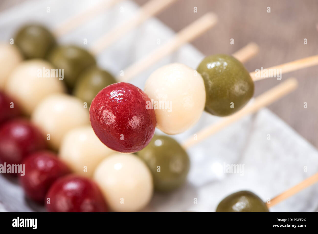 Japanese Dango dessert with 3 different color in pink(red), white, and ...
