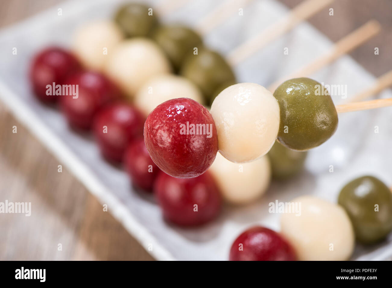 Japanese Dango dessert with 3 different color in pink(red), white, and ...