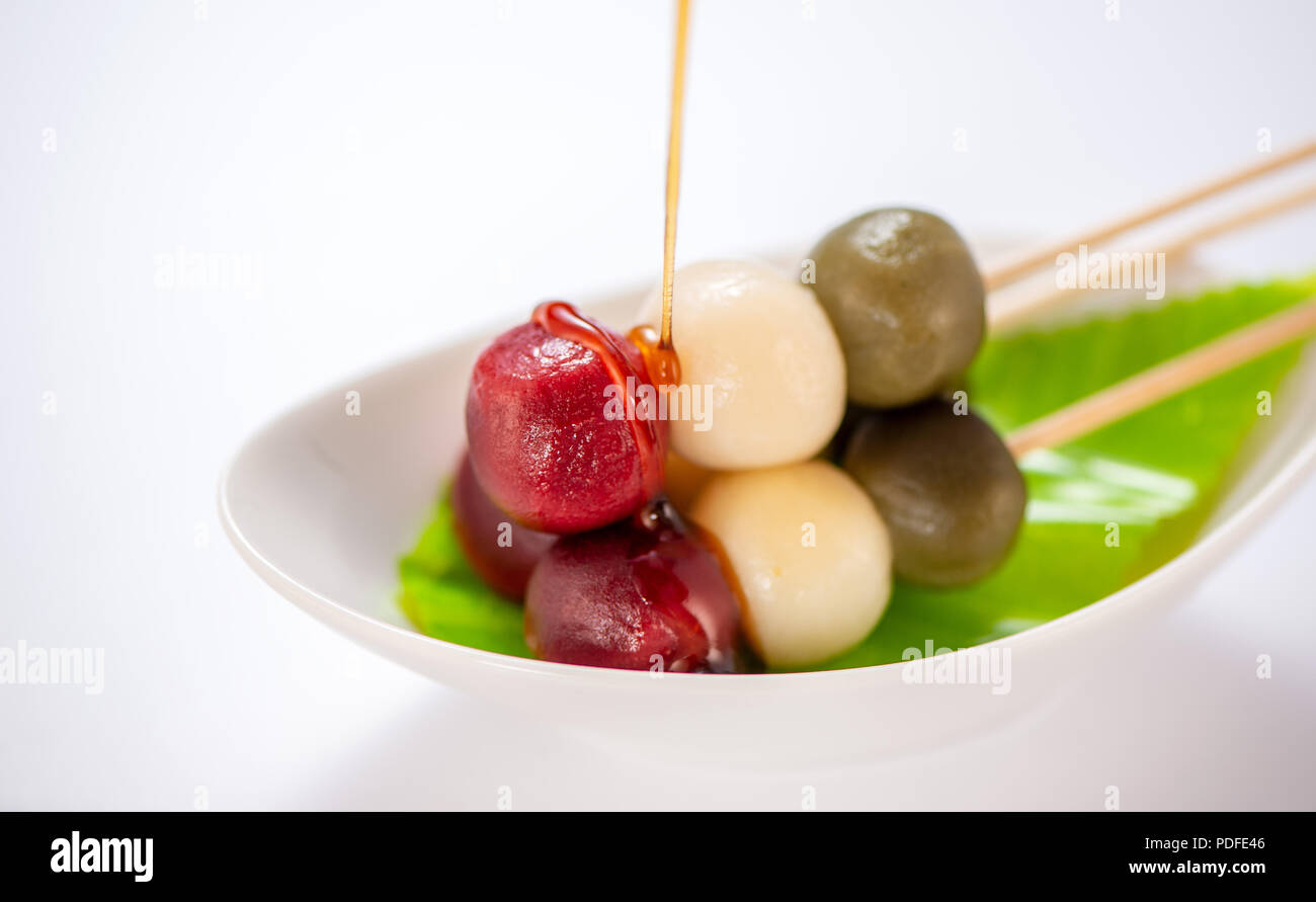 Japanese Dango dessert with 3 different color in pink(red), white, and ...