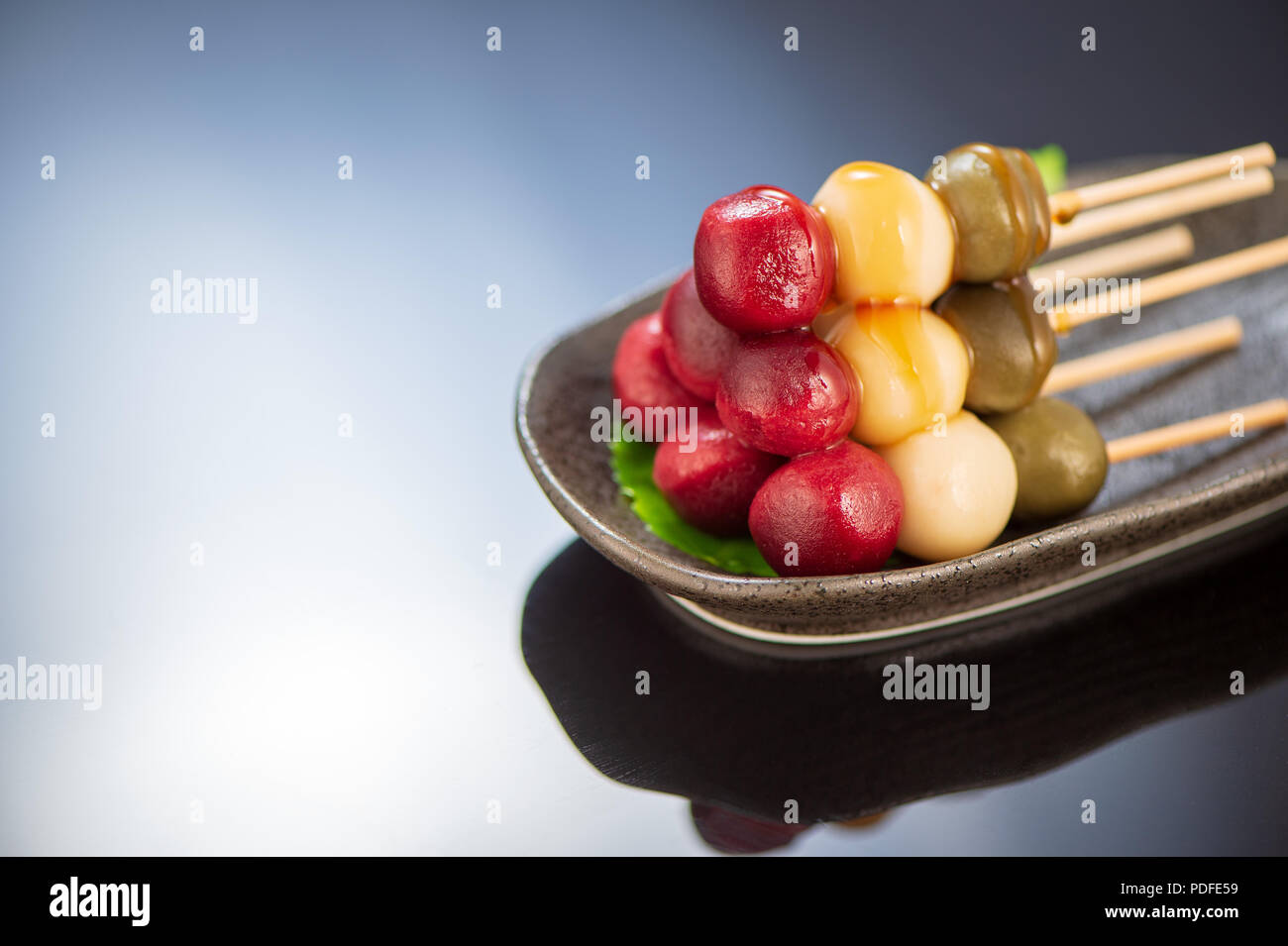Japanese Dango dessert with 3 different color in pink(red), white, and ...