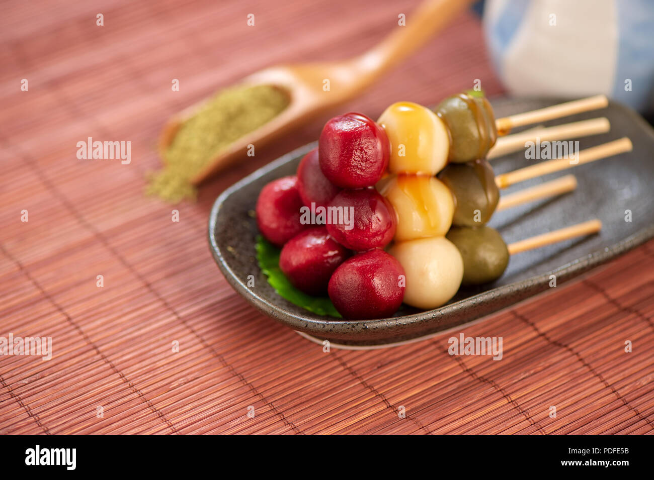 Japanese Dango dessert with 3 different color in pink(red), white, and ...