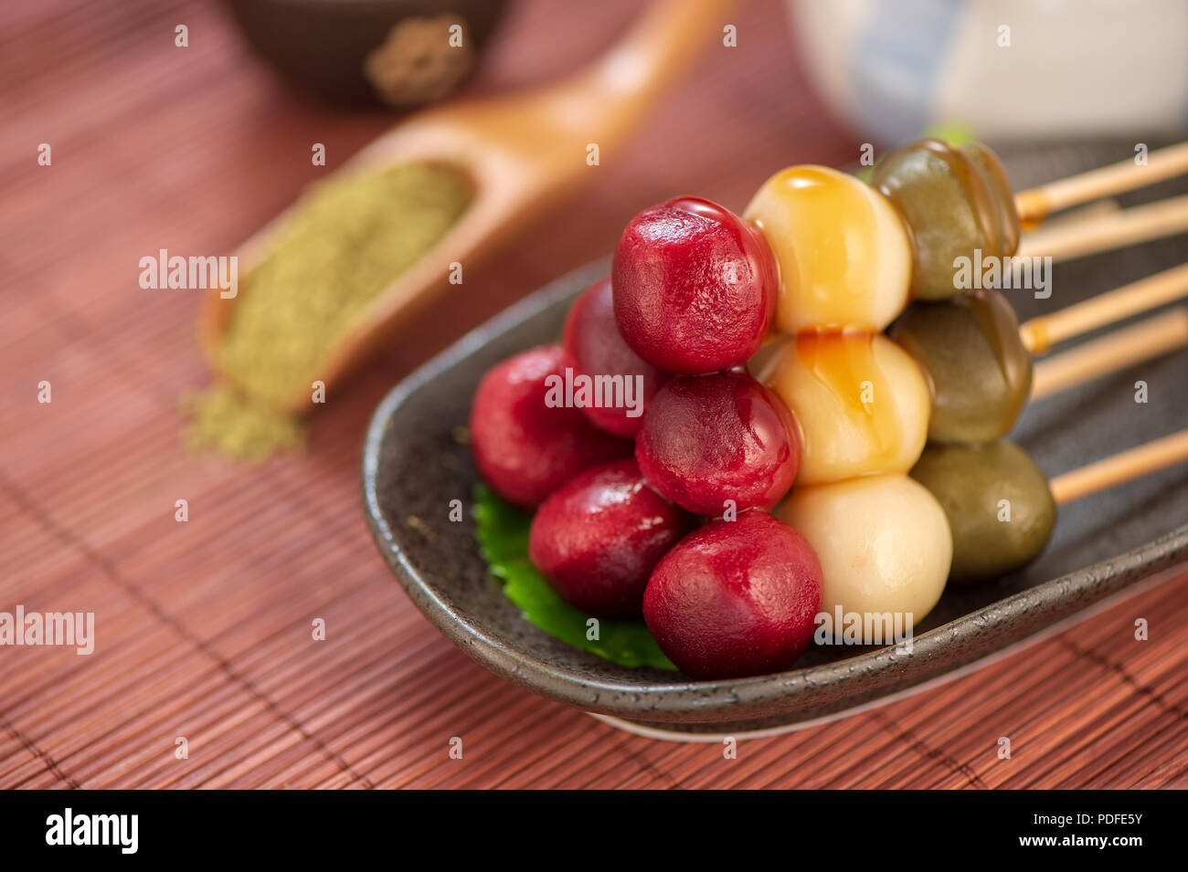 Japanese Dango dessert with 3 different color in pink(red), white, and ...
