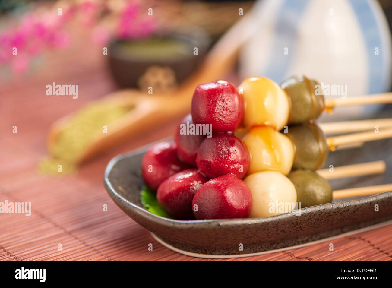 Japanese Dango dessert with 3 different color in pink(red), white, and ...