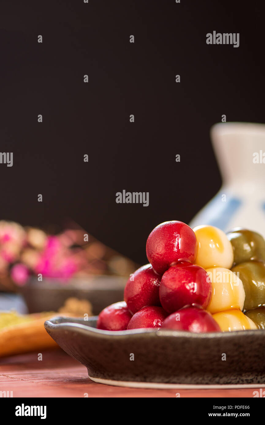 Japanese Dango dessert with 3 different color in pink(red), white, and ...