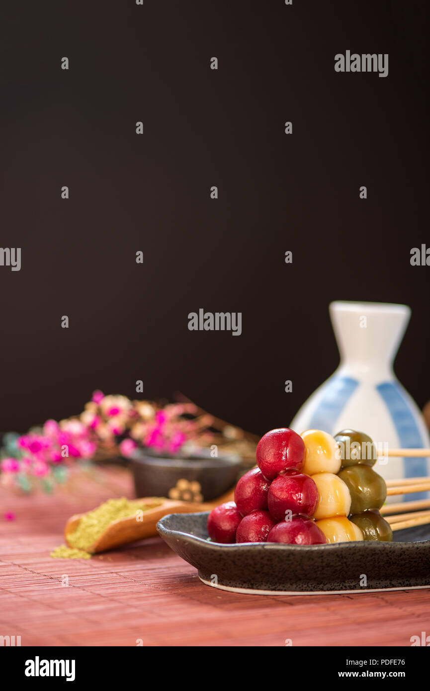 Japanese Dango dessert with 3 different color in pink(red), white, and ...