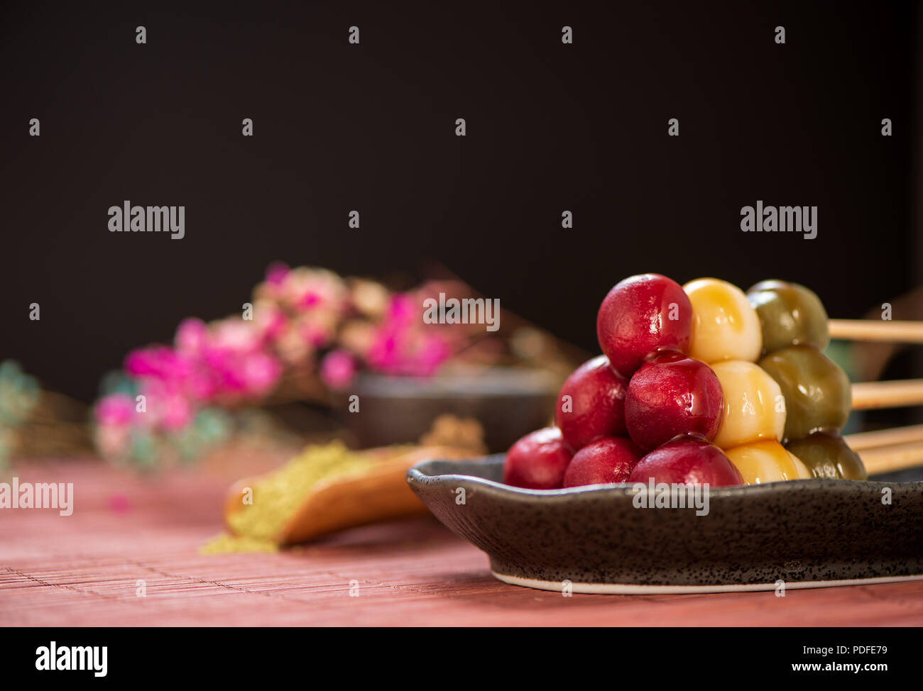 Japanese Dango dessert with 3 different color in pink(red), white, and ...