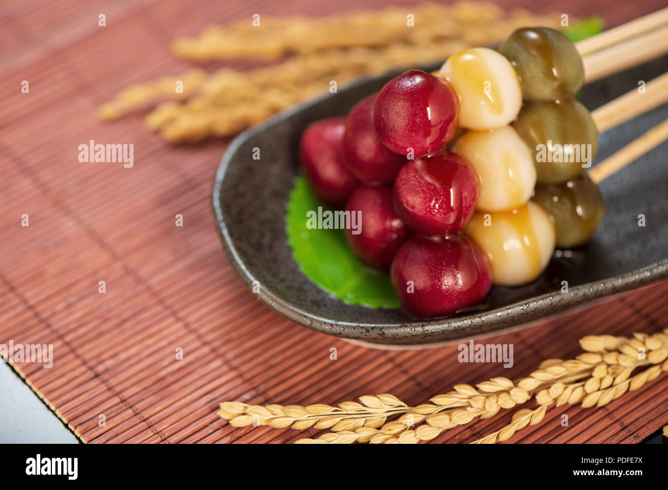 Japanese Dango dessert with 3 different color in pink(red), white, and ...