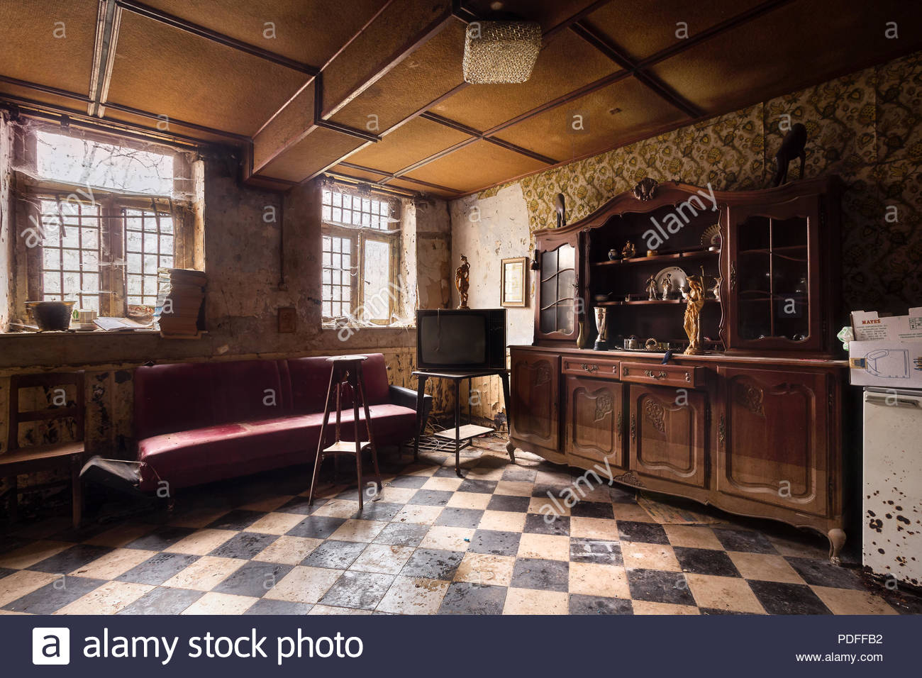Decaying interior of an abandoned building with peeling paint and ...