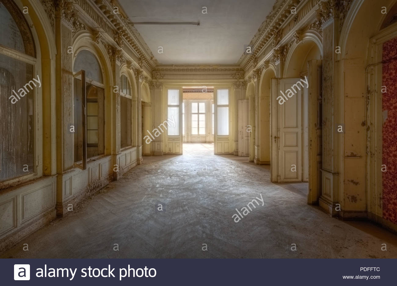 Decaying interior of an abandoned building with peeling paint and ...