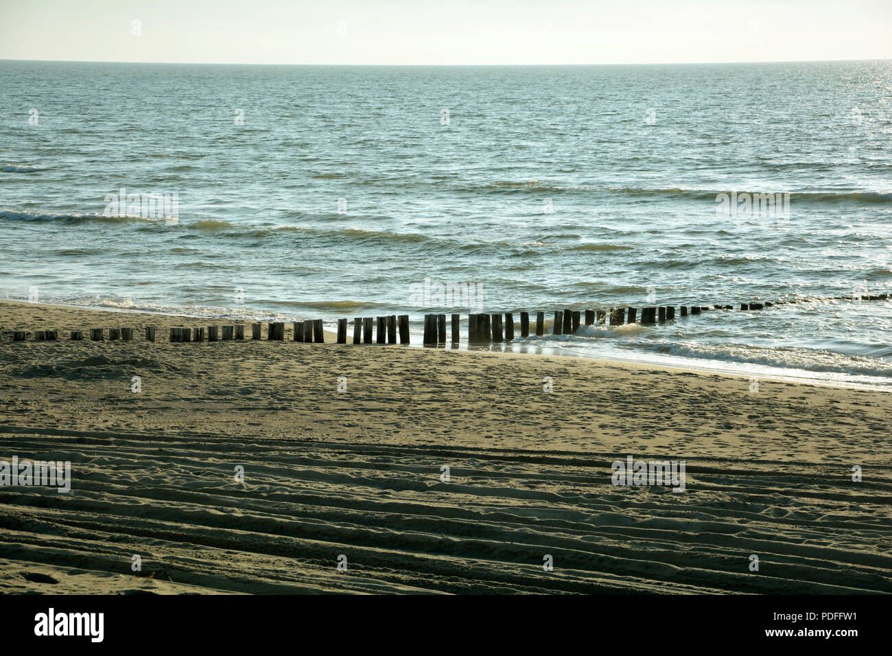 Beach with wooden stages on the North Sea at sunset Stock Photo - Alamy