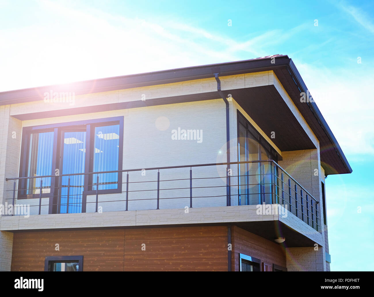Sunny day. New modern architectural house with windows Stock Photo - Alamy