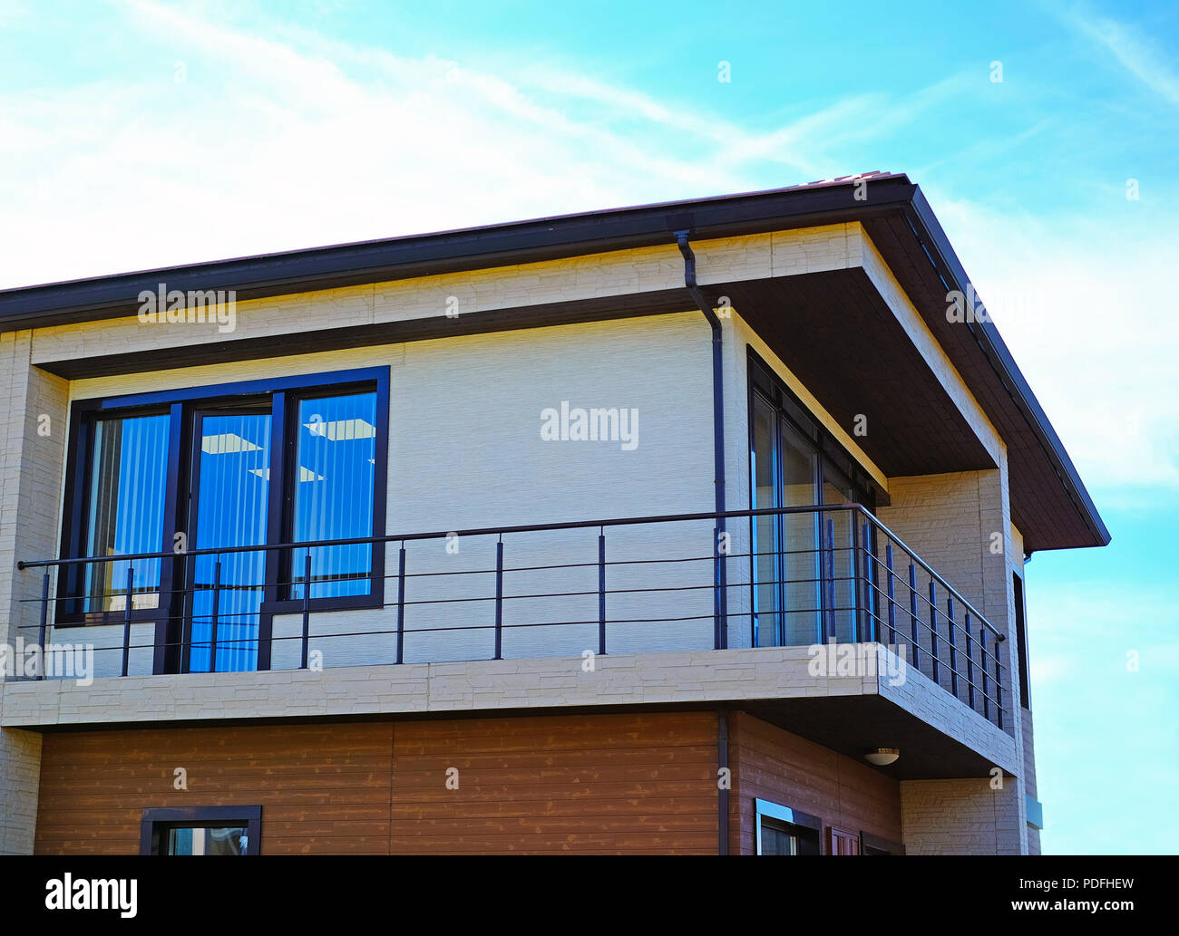Sunny day. New modern architectural house with windows Stock Photo - Alamy