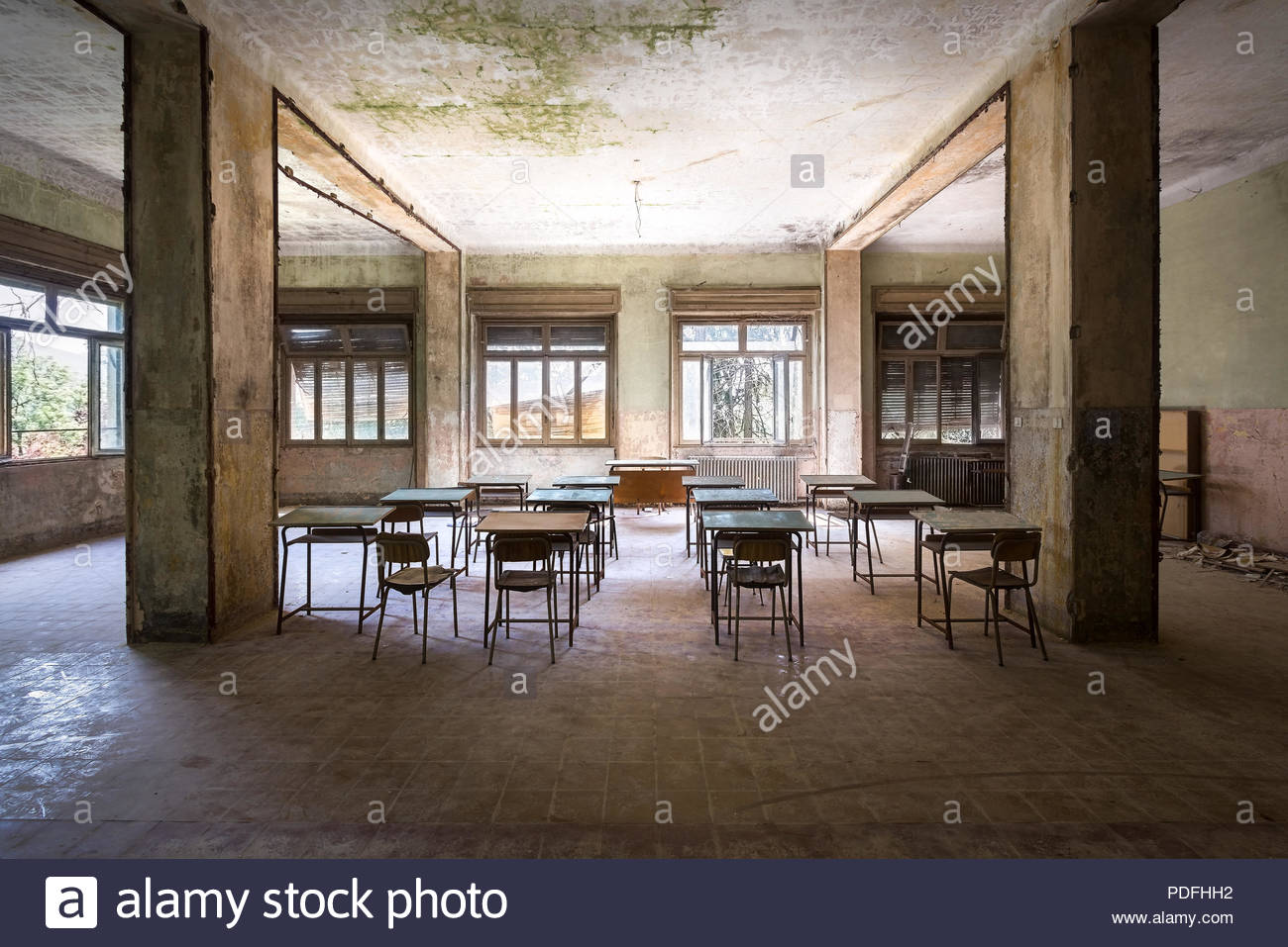 Decaying interior of an abandoned building with peeling paint and ...