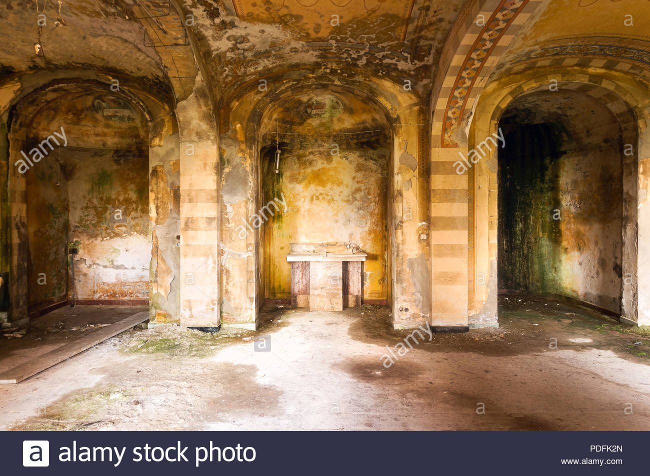 Decaying interior of an abandoned building with peeling paint and ...