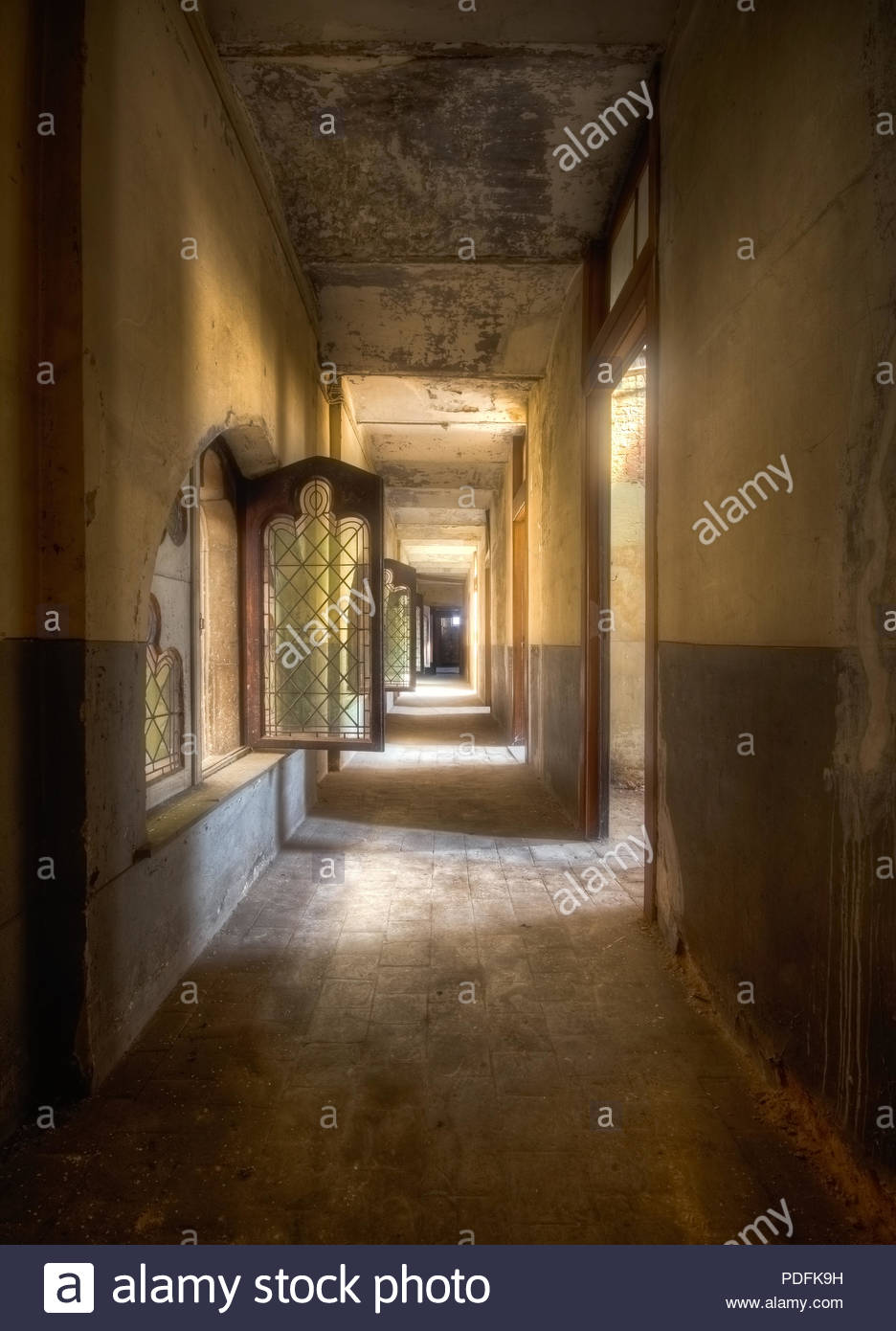 Decaying interior of an abandoned building with peeling paint and ...
