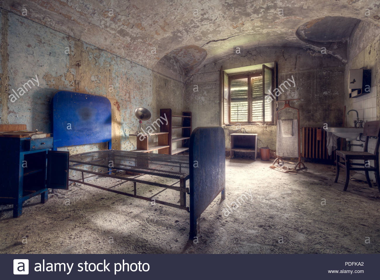 Decaying interior of an abandoned building with peeling paint and ...